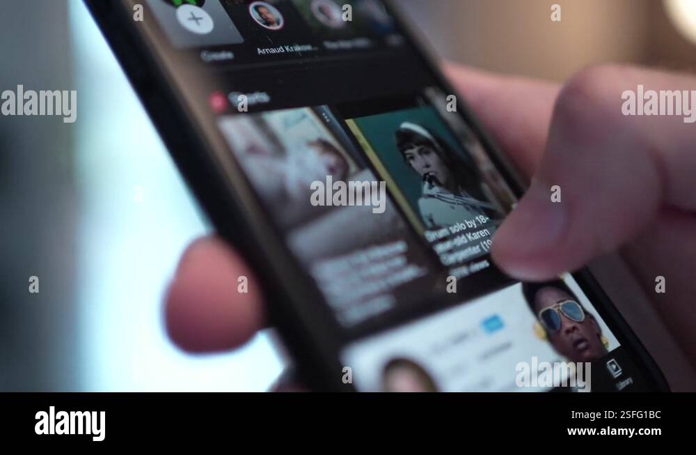 Browsing Videos on the YouTube App on a Mobile Smartphone Closeup Stock ...