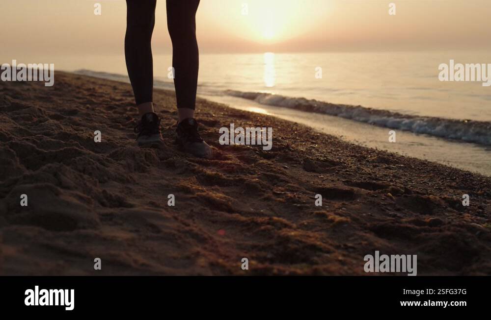 Sporty girl putting down mat at sunrise. Yoga woman preparing to ...