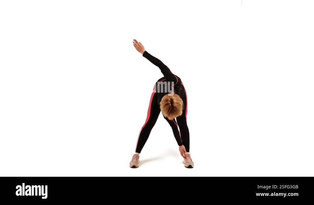 Touching your toes diagonally aerobic exercise on a white backdrop ...