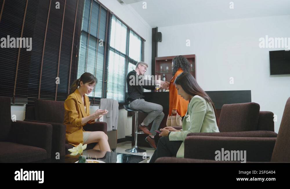 A group of businessmen sitting talking at the VIP airport lounge Stock ...