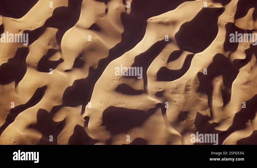 Aerial top view on sand dunes in desert Stock Video Footage - Alamy
