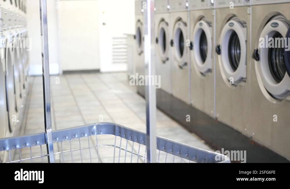 Washing machines, public coin laundry, USA. Self-service laundromat ...