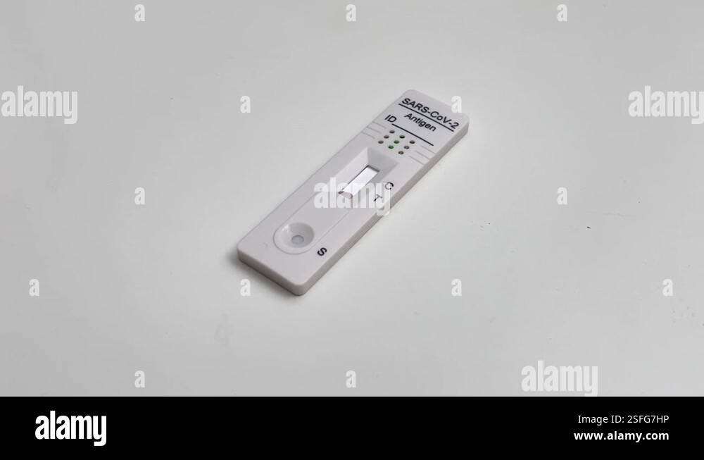 Performing COVID-19 antigen flow test. Flow to a positive result on the ...