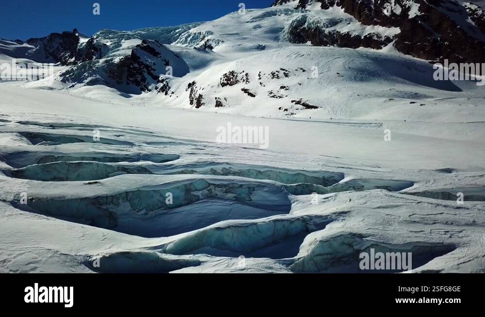 Blue glacier in the swiss alps, high mountain. Visible crevices Stock ...