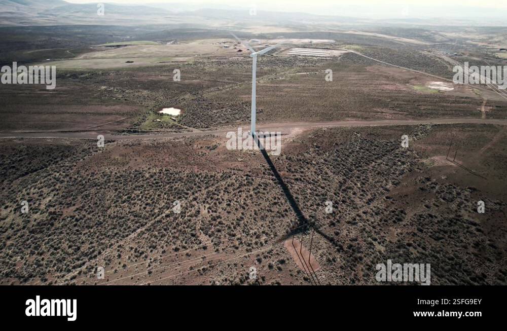 A tall wind powered electric turbine creates green sustainable carbon ...