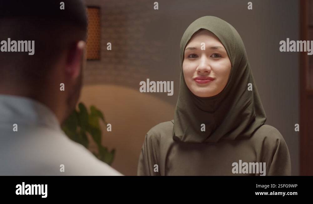 Portrait of young woman in hijab. Wearing traditional Islamic female ...