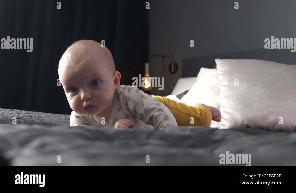 Baby rolling on bed Stock Videos & Footage - HD and 4K Video Clips - Alamy