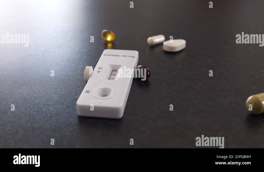 Medical pills dropped on positive lateral flow test kit Stock Video ...