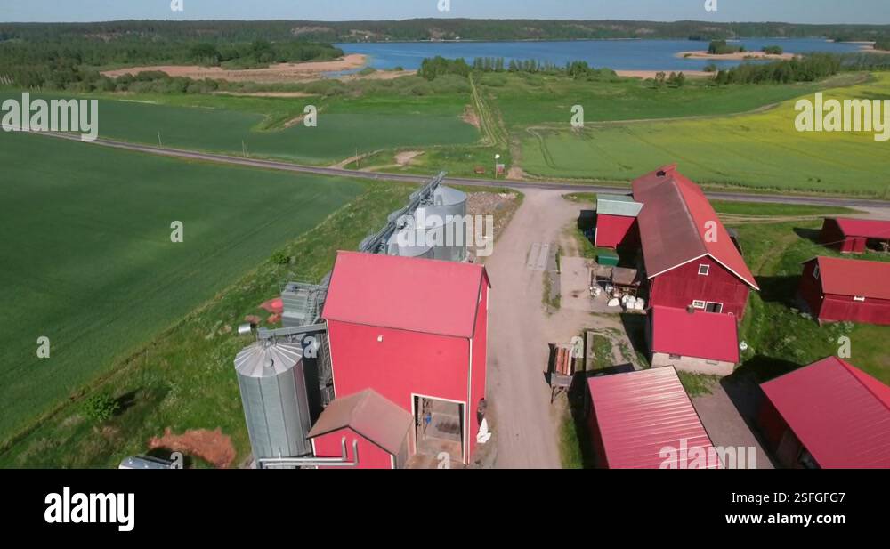 Aerial Tilt Down Shot Of Factories And Silo On Green Landscape, Drone ...