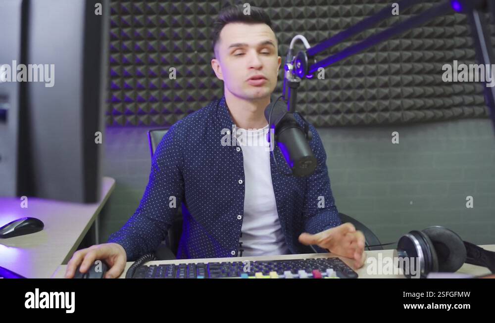 a radio host conducts a live broadcast in a professional radio studio ...