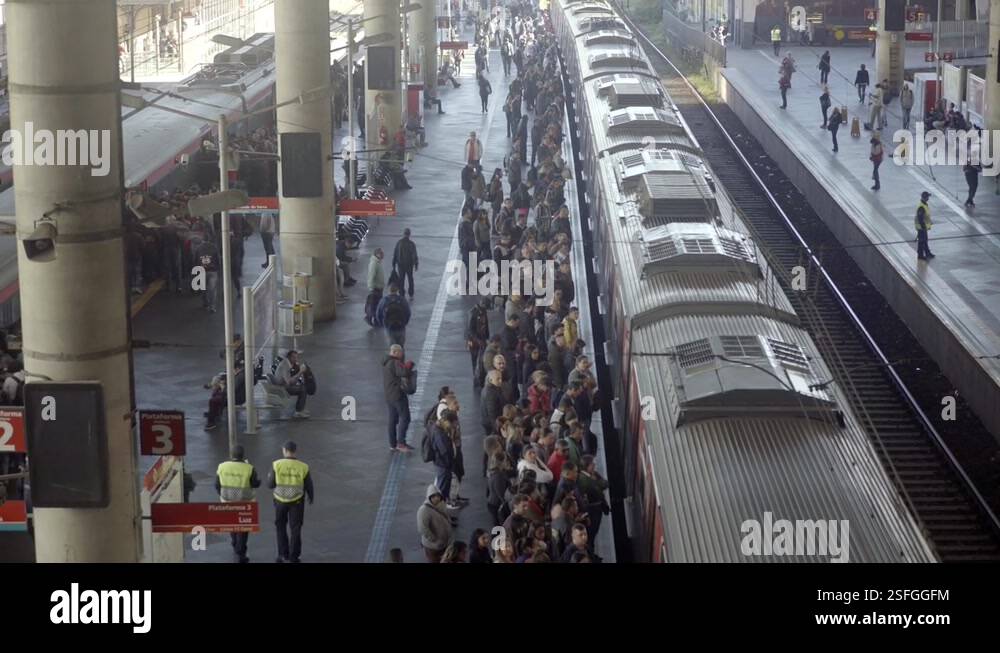 People getting on and off train at station in Sao Paulo city. Gimbal ...