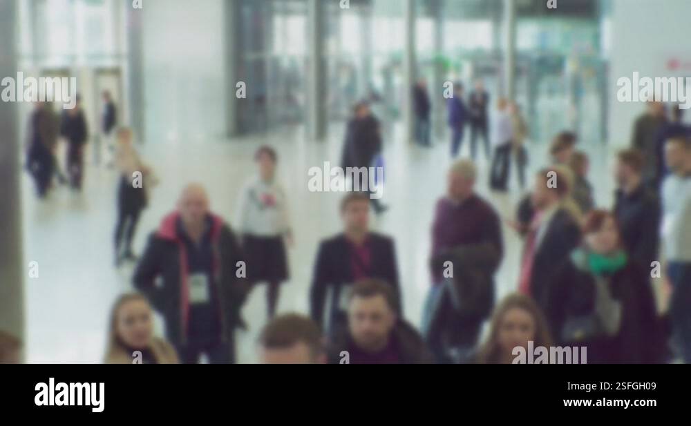 silhouettes of many unrecognizable people in a large hall Stock Video ...