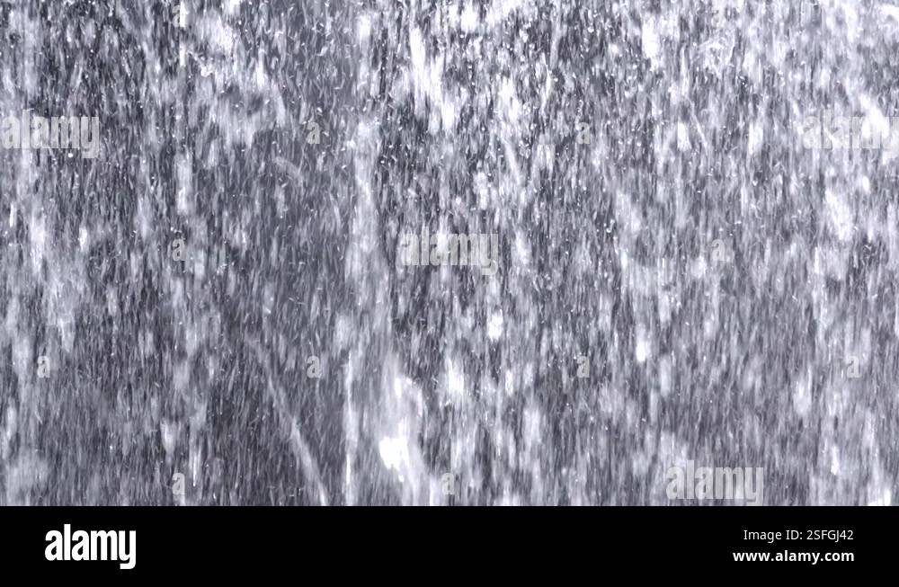Closeup of water spurting from the fountain. Water jet splashing. 4K ...
