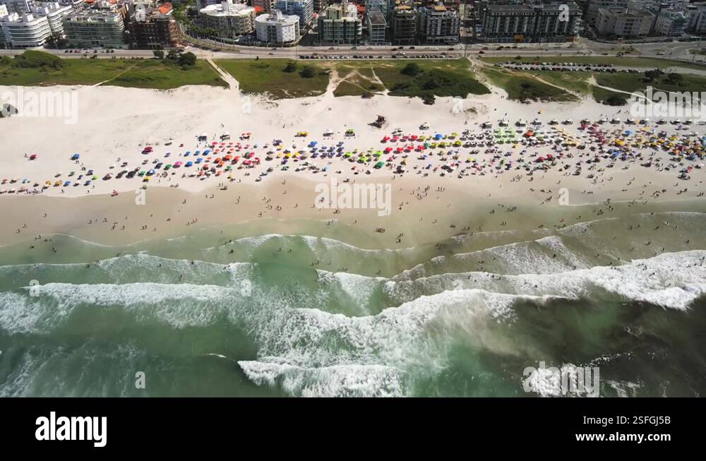 spring break, people on a beautiful white sand beach in Rio de Janeiro ...