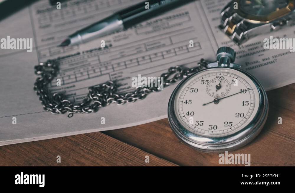 Antique Stopwatch Lies on Wooden Desk with Old Documents and Counts ...