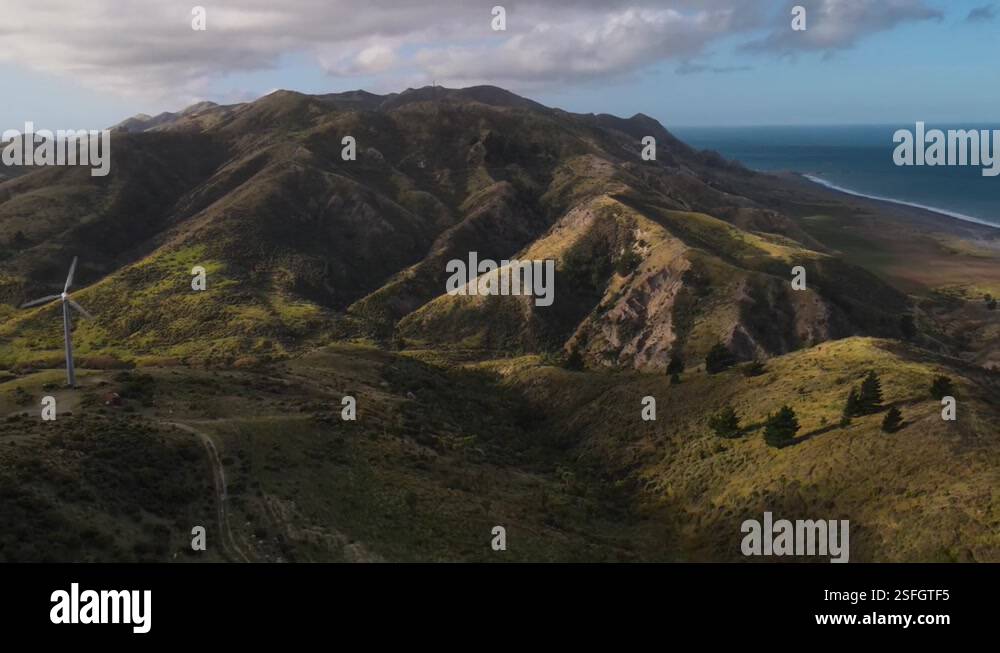 Stunning aerial reveal of windmill turbines and towers located on New ...