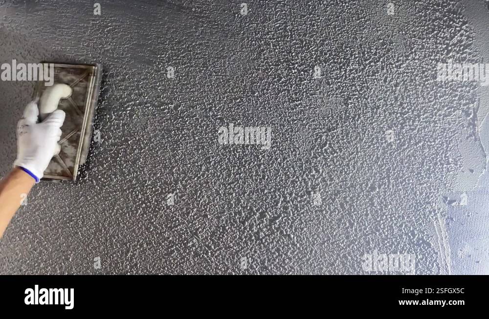 Applying a decorative microcement coating to the floor Stock Video ...