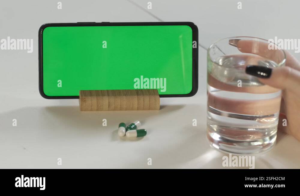 Handheld Camera: Back View of Brunette woman Holding Chroma Key Green ...