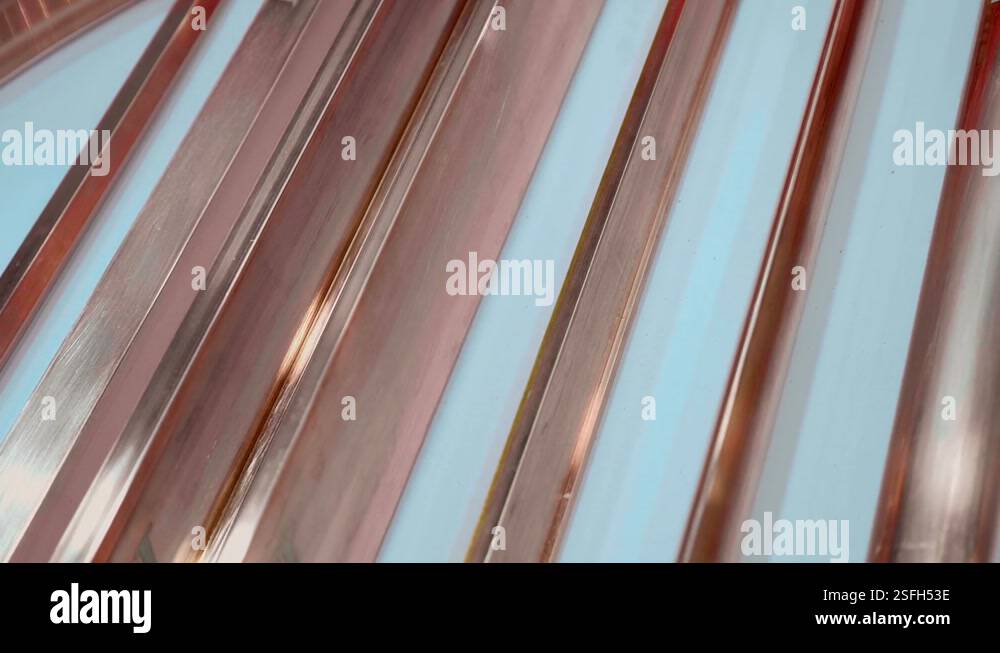 Rows of copper blanks of various sizes and profiles glisten in the ...
