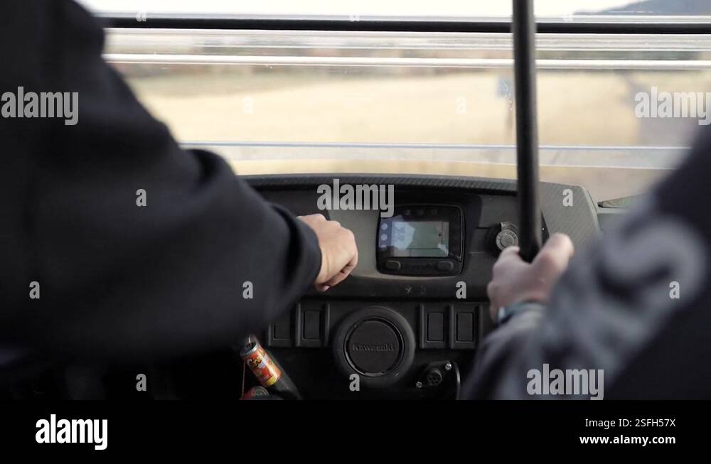 Two Young Men Turning the Key to Start a Ranger Four Wheeler in the ...