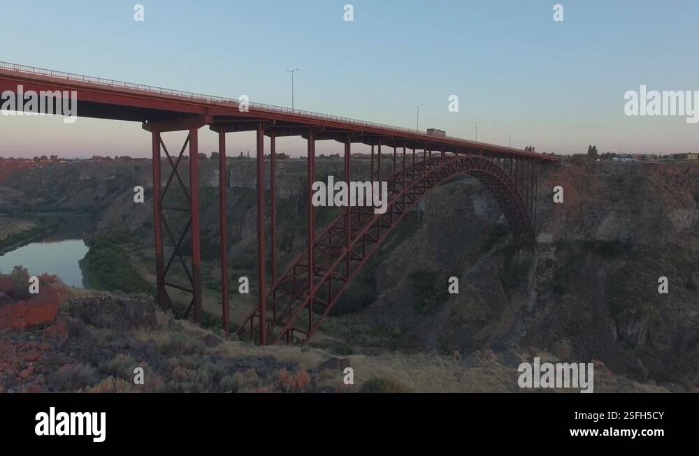 Twin Falls Idaho bridge over river during sunset drone 4k low angle ...