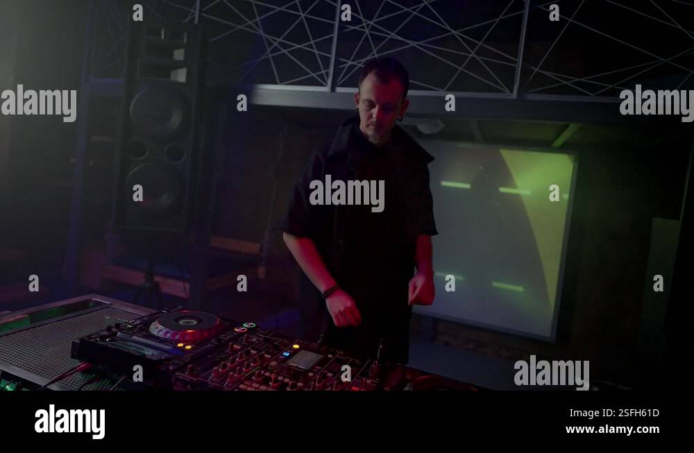 Confident DJ performs new music mix in popular nightclub Stock Video Footage - Alamy