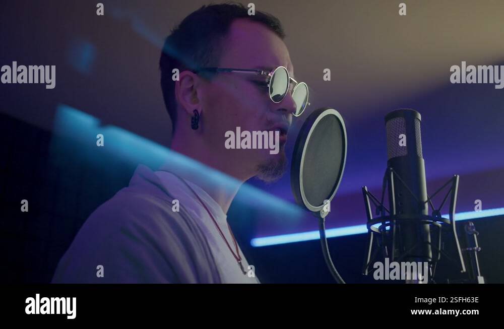 Talented young singer records songs in professional studio Stock Video ...