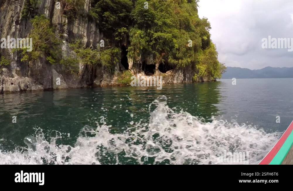 Point Of View Motorboat Splashing Water Moving In Sea By Mountains ...