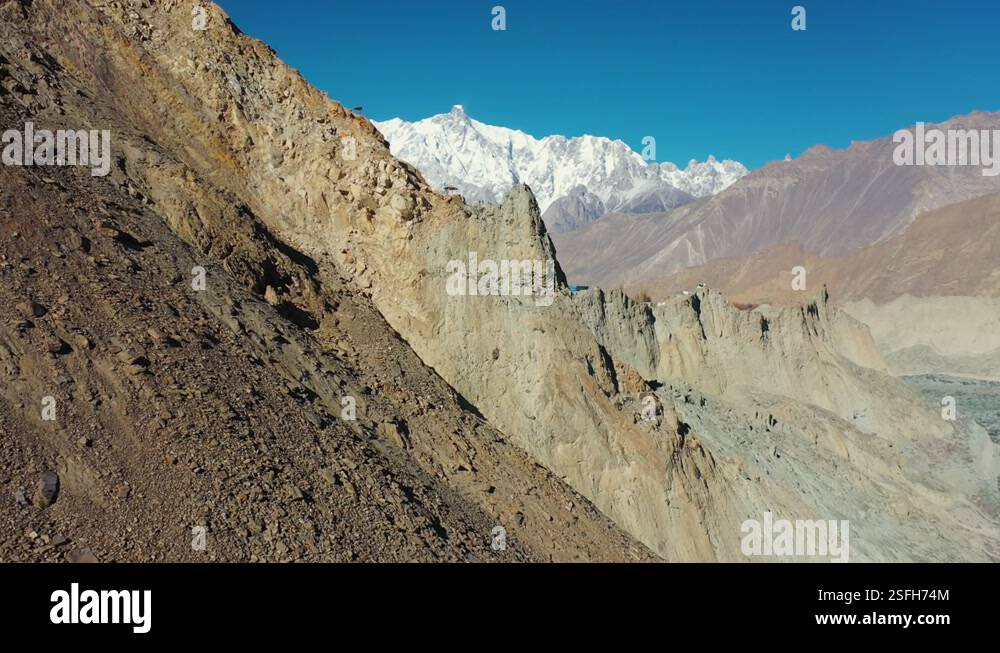 Aerial Panning A Steep Mountainside And Rugged Glacier Valley - Hunza ...