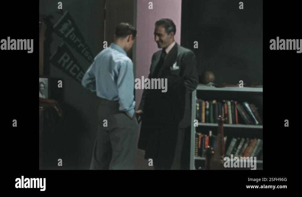 1950s: Father and son talking at the bedroom door, father leaves. Dog ...