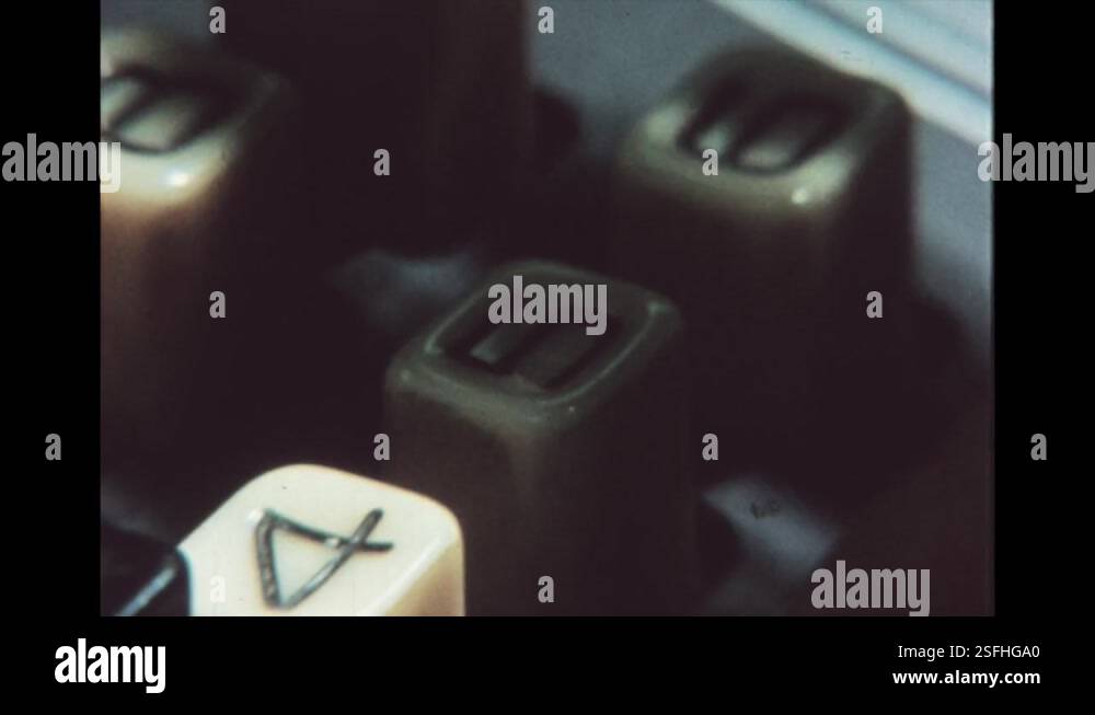 1970s: fingers type keys. Digits on calculator. Victor copier. Man ...