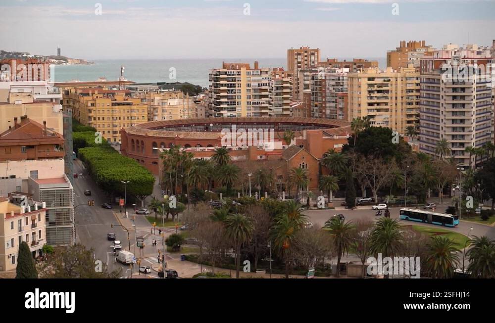 Famous bullfighting arena in Malaga, Spain with skyscrapers in ...