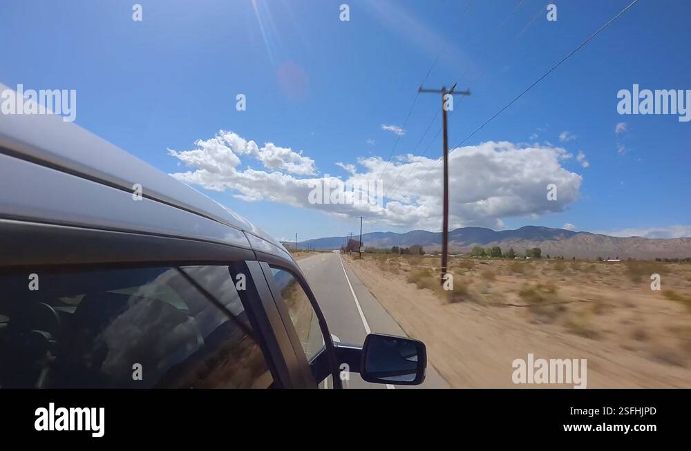 Driving through the Mojave Desert with a dynamic cloudscape overhead ...