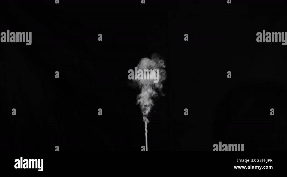 Slow motion single stream of smoke erupting from the bottom middle of ...