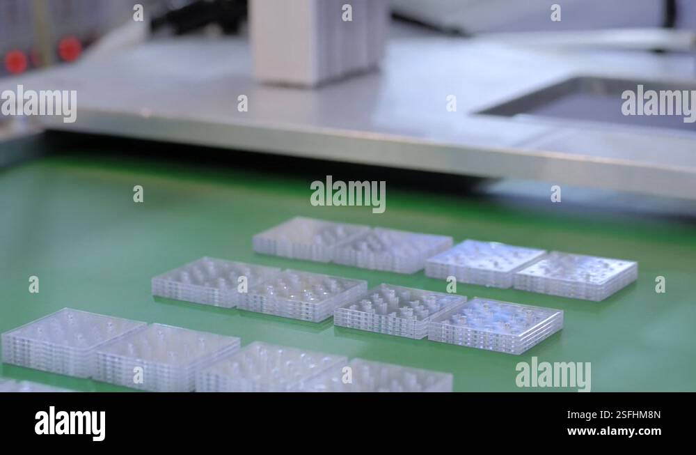 Pick and place robotic arm manipulator moving plastic detail on ...