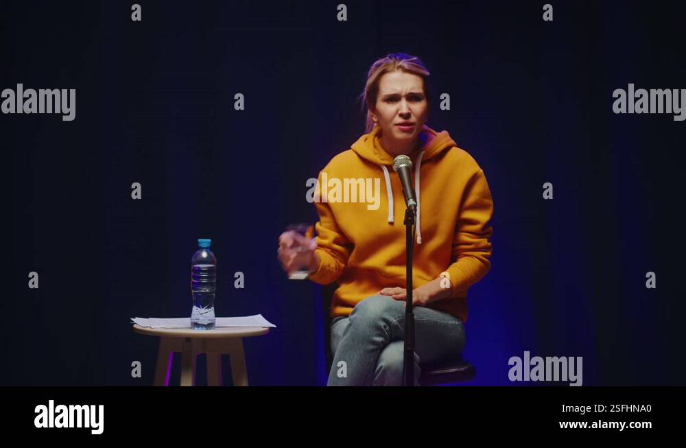 Stand-up cafe, woman comedy concert. Woman telling jokes on stage ...