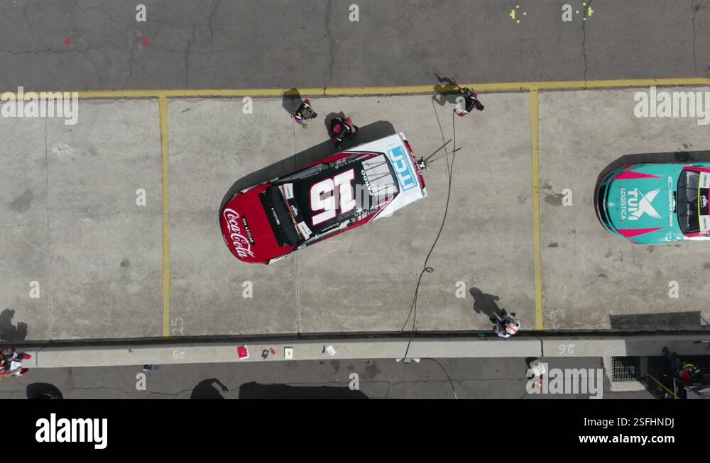 Top down view of Racing team working at pit stop, formula 1. NASCAR ...
