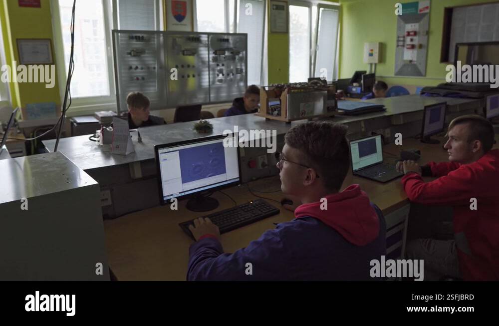 Students Facing Their Computers Inside A Classroom In Vocational School ...
