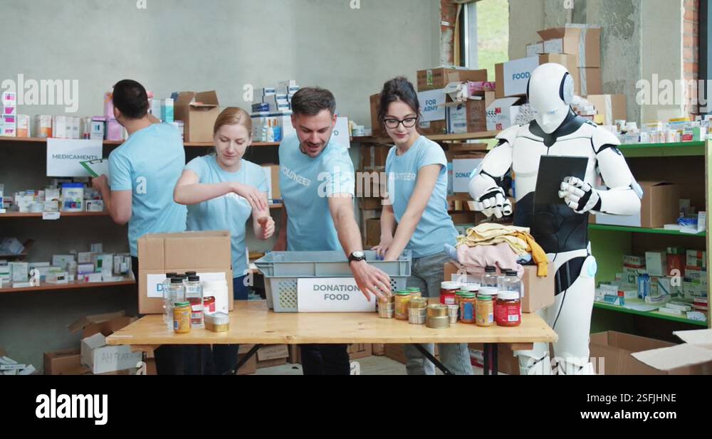 Team of young people sorting and packing donation boxes together at ...