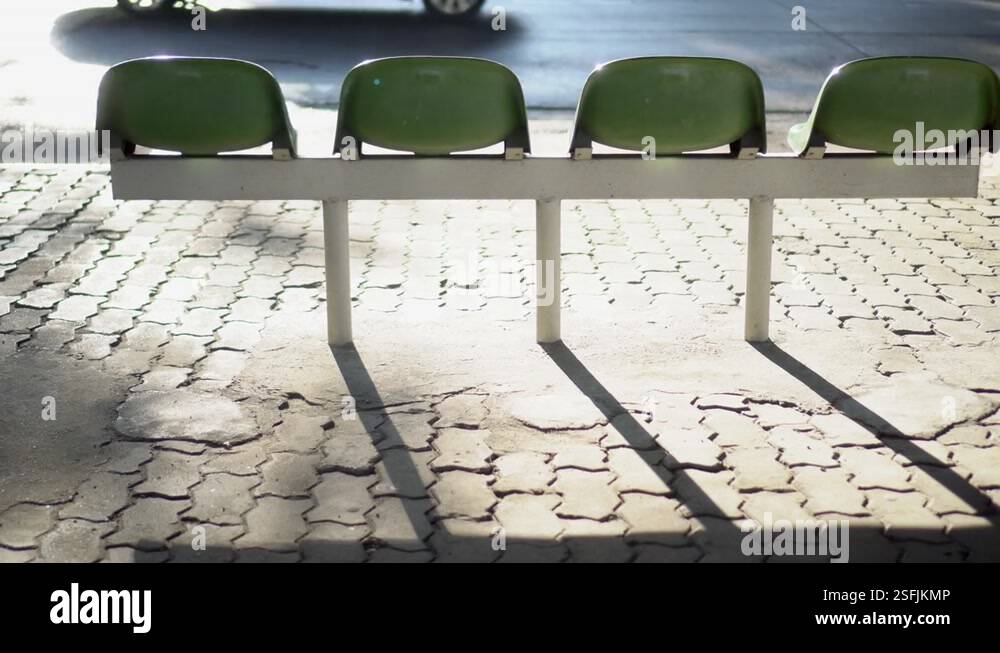 Cinematic urban scene of Bangkok Thailand bus stop seating in light and ...