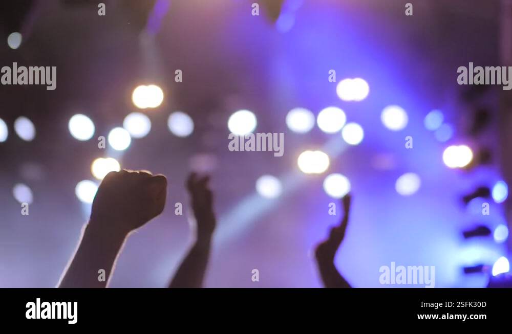 Slow motion: people crowd silhouette partying at rock concert in front ...