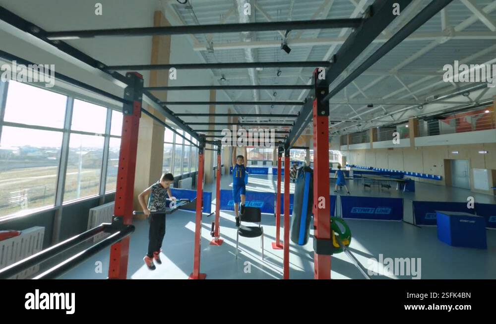 Gym with exercise bars ping-pong tables and wrestling arena Stock Video ...