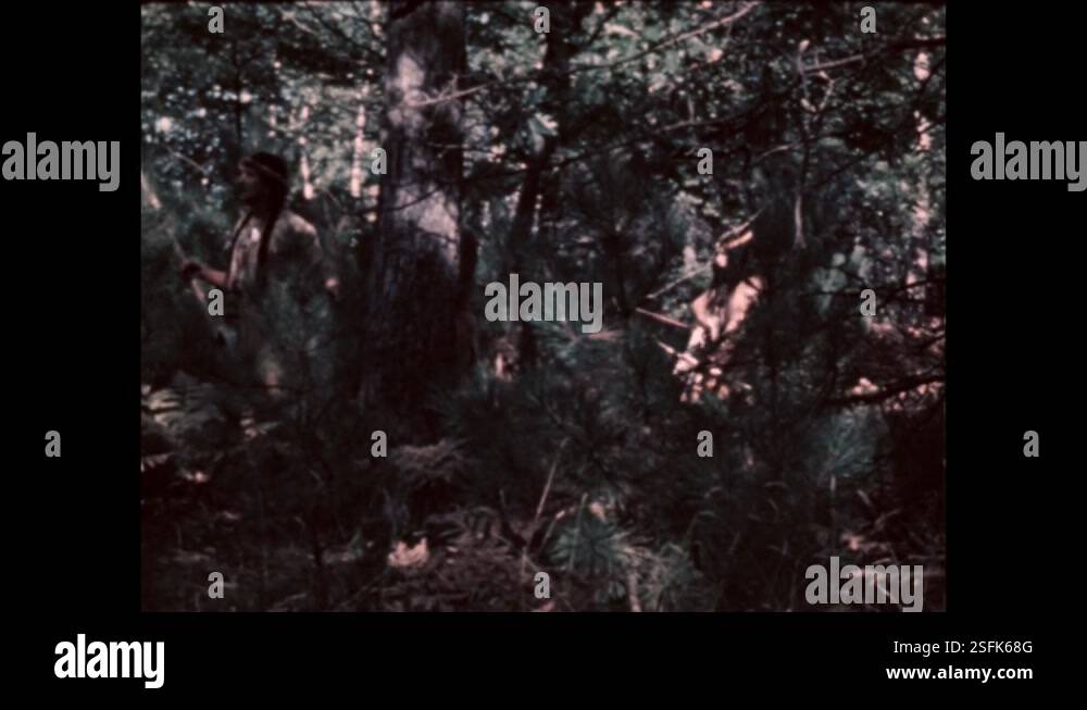 1950s: Native American man and boys walking through woods. Man and boys ...