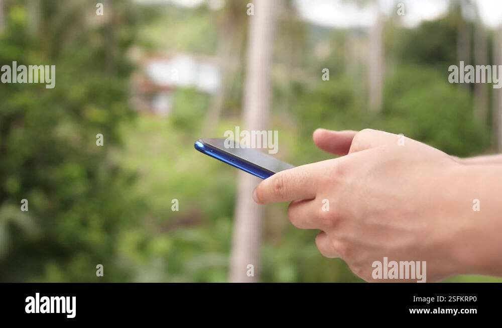 Male hands using google maps in a smart phone. Man holds phone in hands ...
