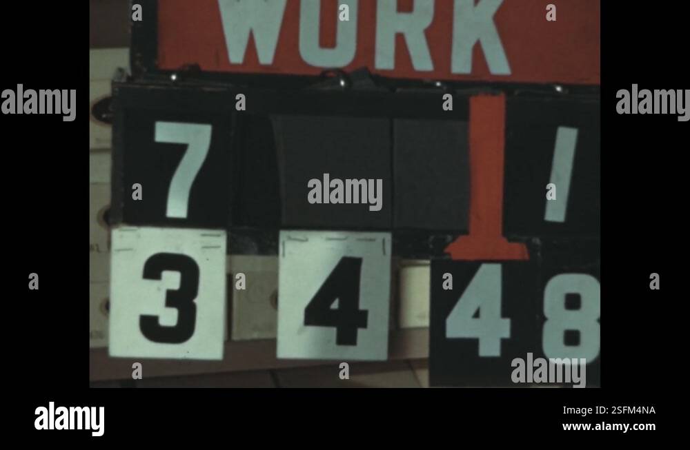1940s: Work title on clapper board. Number 34. Hands wrap shoes in ...