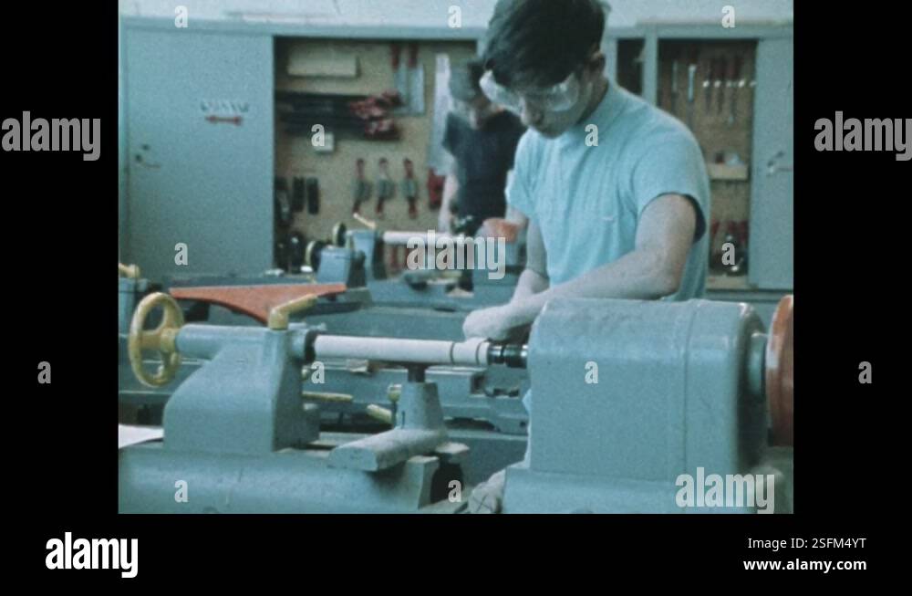 1970s: Man using weight machine. Football player running. Zoom in, boy ...