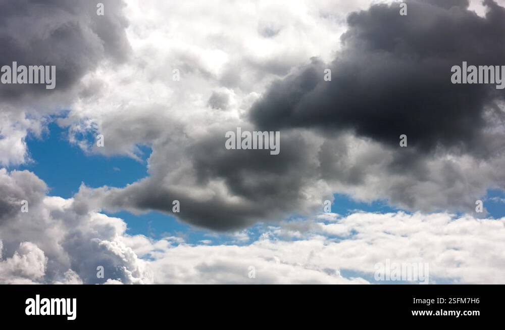 cumulus clouds at spring day light in second full-frame time lapse ...
