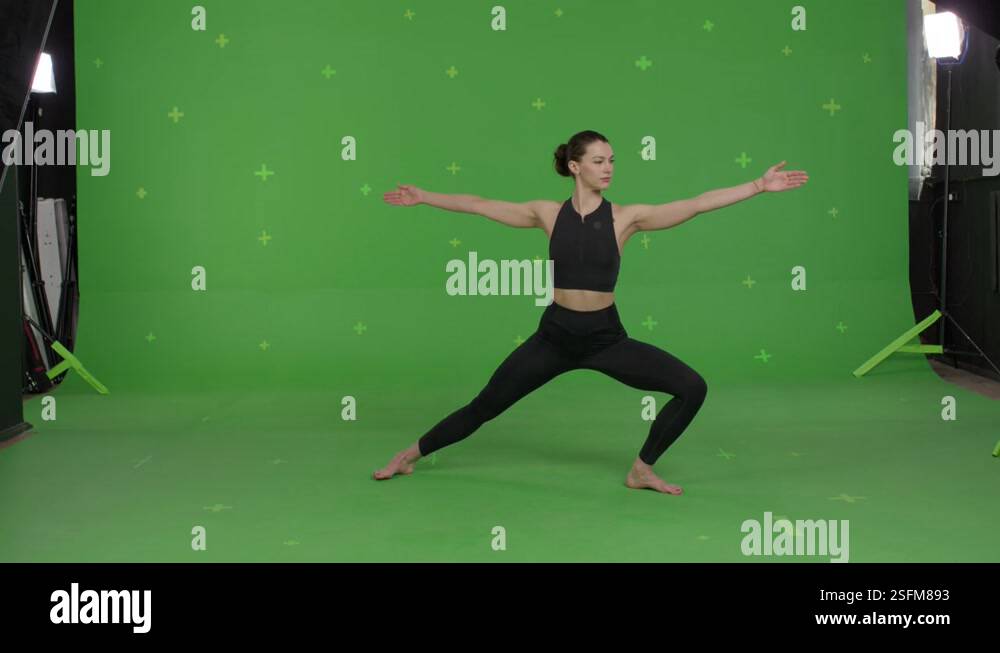 GREEN SCREEN CHROMA KEY Young sporty female yoga coach showing ...