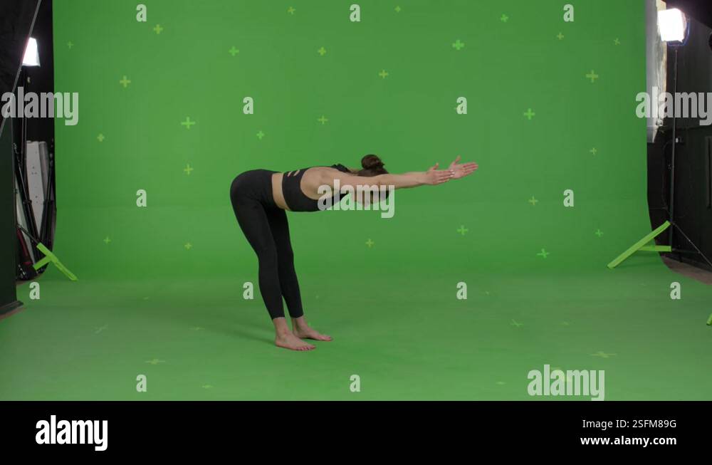 GREEN SCREEN CHROMA KEY Young sporty female yoga coach showing ...