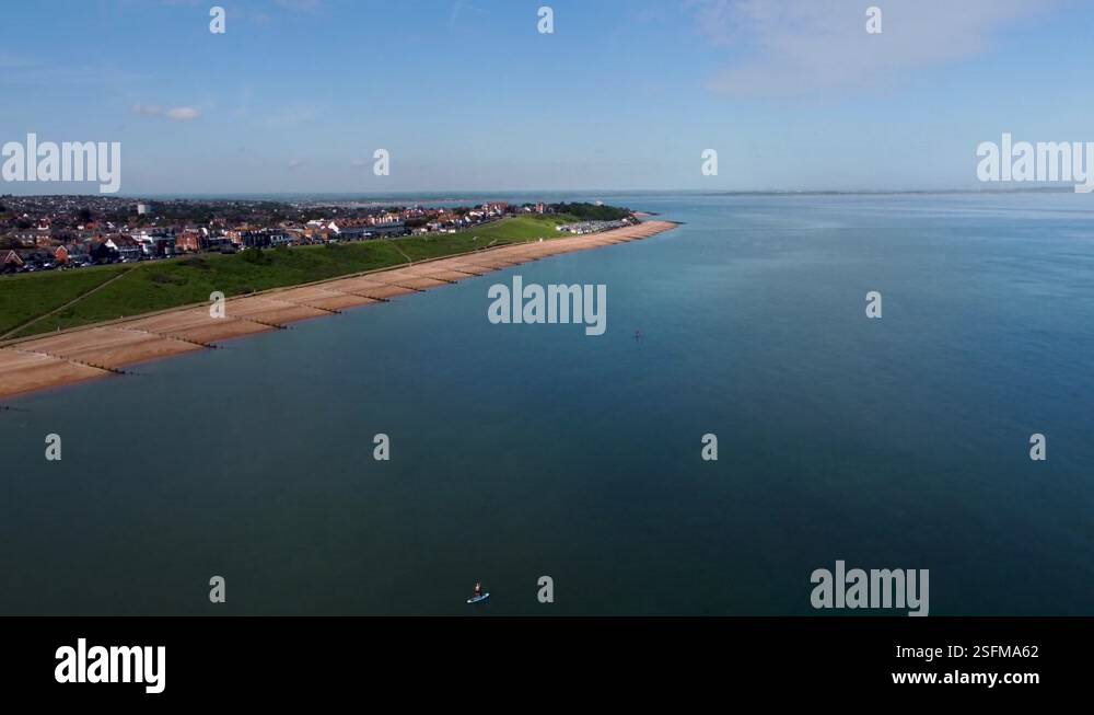 A scenic dolly-forward flyover of Tankerton beach late in the evening ...